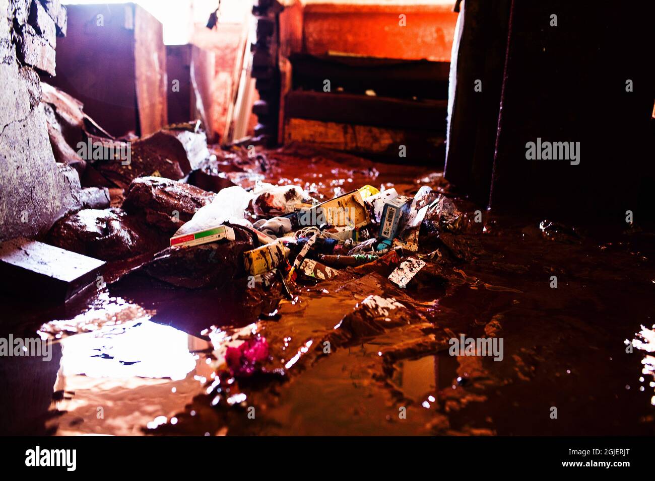 A house destroyed by toxic red mud in Kolontar. A reservoir of nearby ...