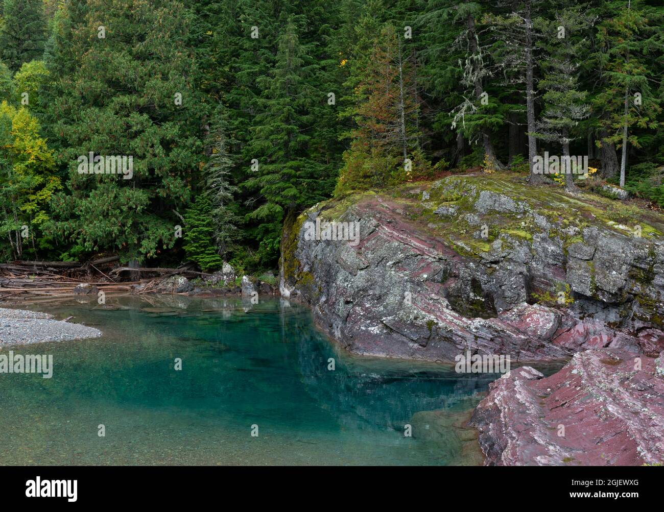 USA, Montana. Rocky outcrop, McDonald Creek, Glacier National Park ...