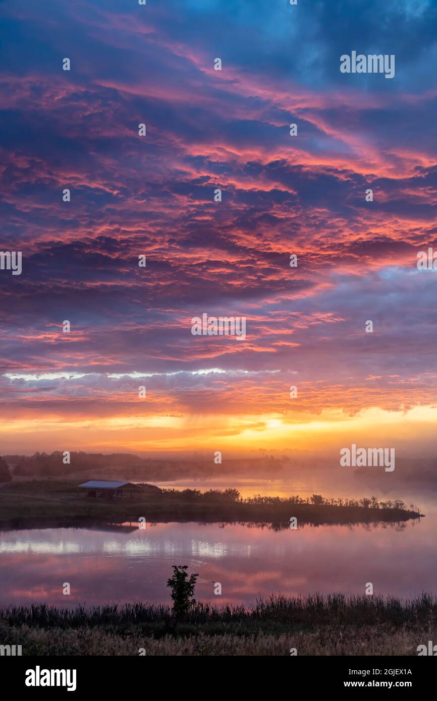Amazing sunrise clouds over small lake at Cub Creek Recreation Area ...