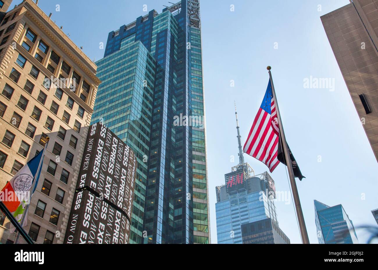 Manhattan, New York. Times Square, American flag with billboards and ...