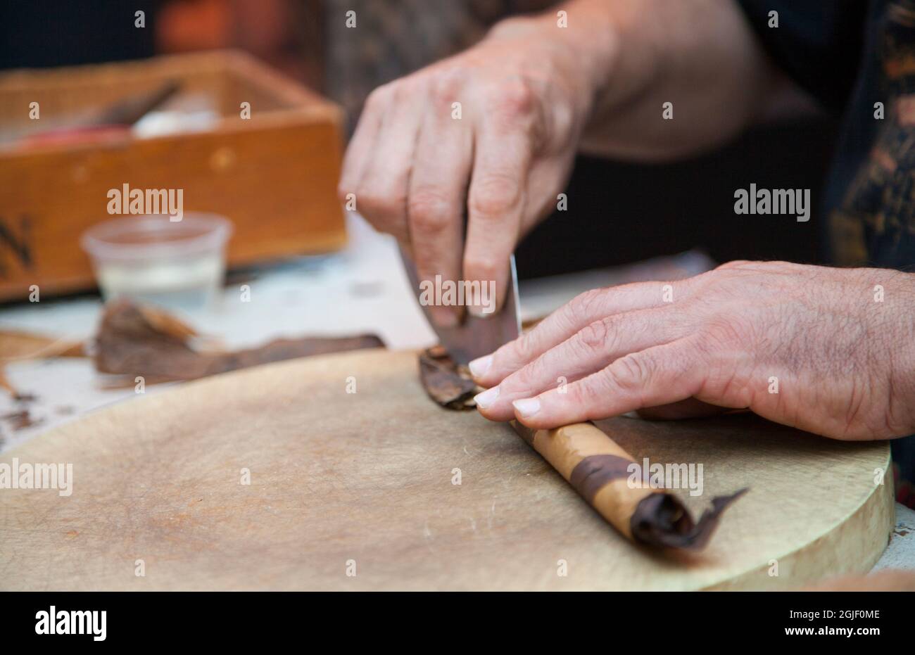 Little Italy, Manhattan, New York. Italian man rolling cigars on street ...