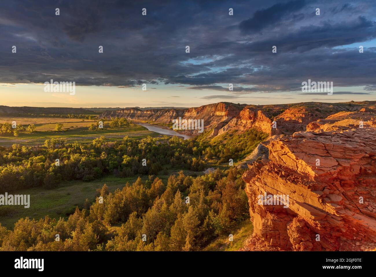 Dramatic light on cliffs over the Little Missouri River in the Little ...