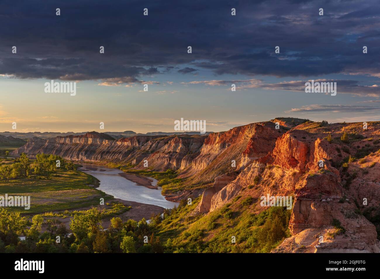 Dramatic light on cliffs over the Little Missouri River in the Little ...