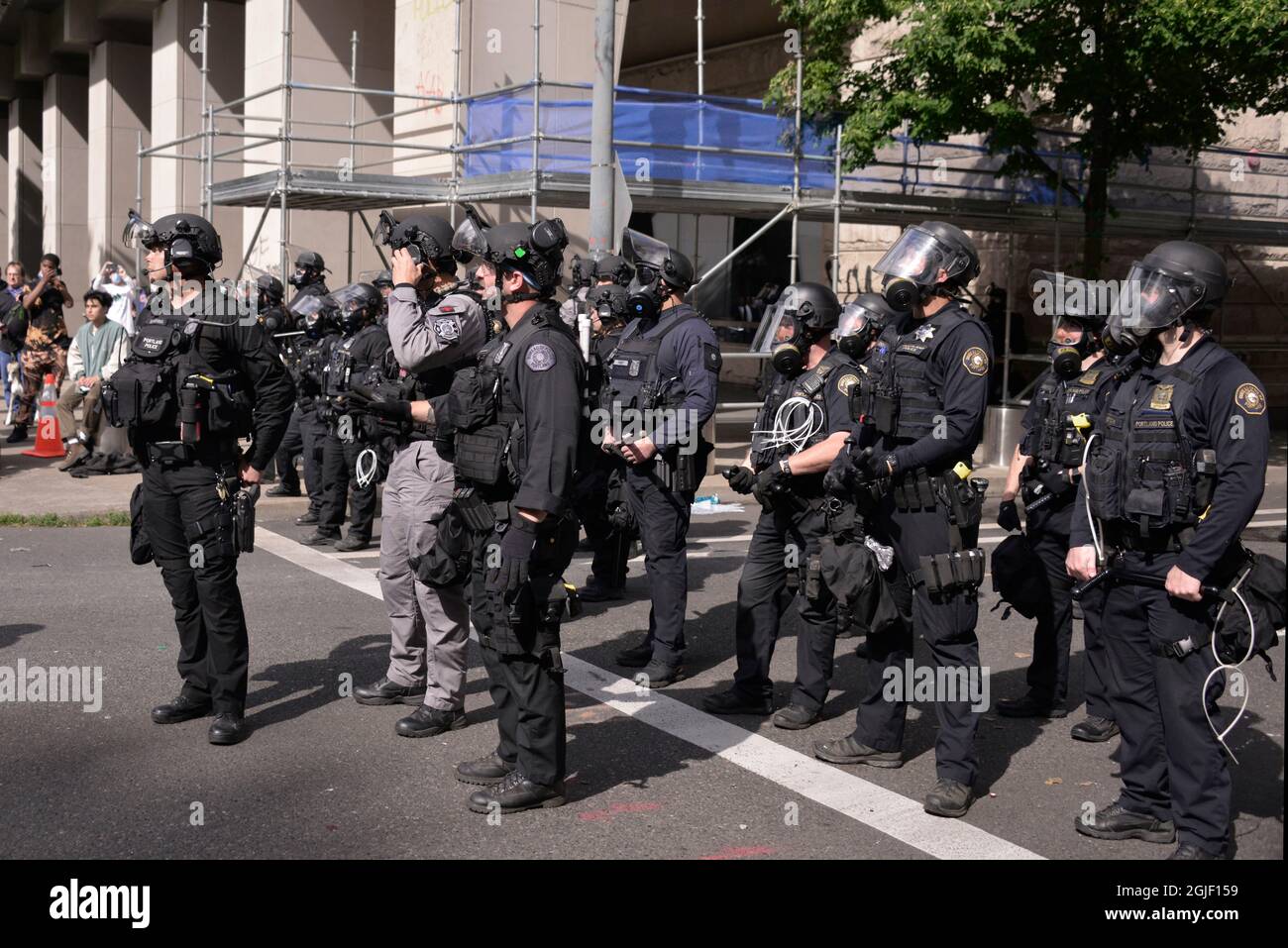 USA, Oregon, Portland. Police protecting Justice Center building during ...