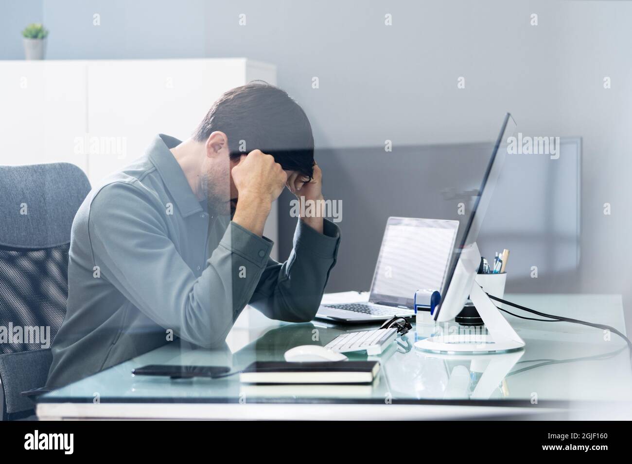Unhappy Stressed Man Behind Office Computer. Bored Employee Stock Photo ...