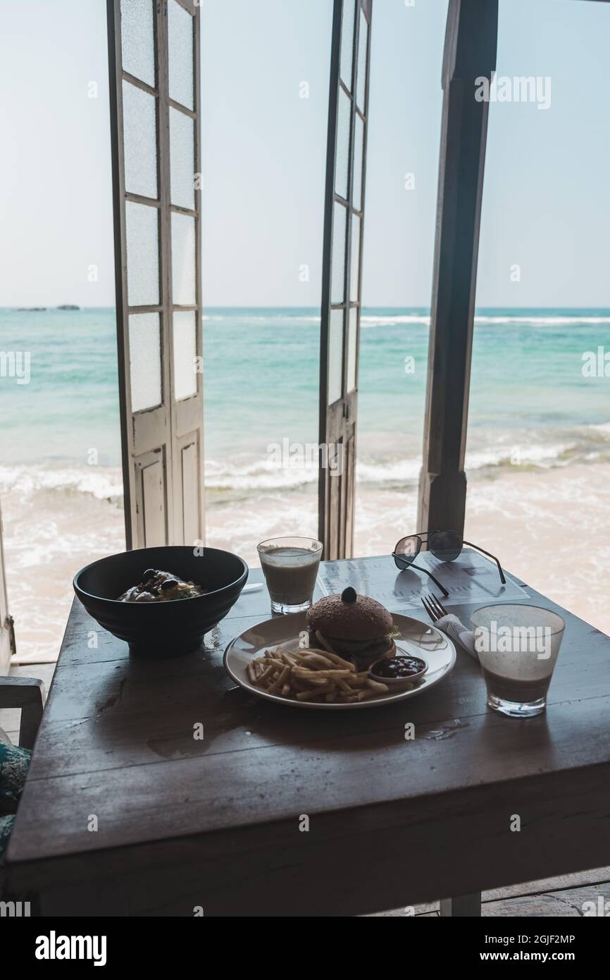 Breakfast overlooking the ocean in a beautiful cafe in asia. Lovely ...