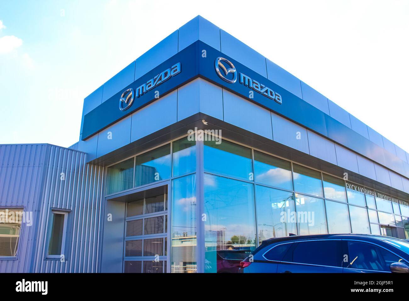 Kyiv, Ukraine - August 15, 2020: retail of Mazda logo on store front ...