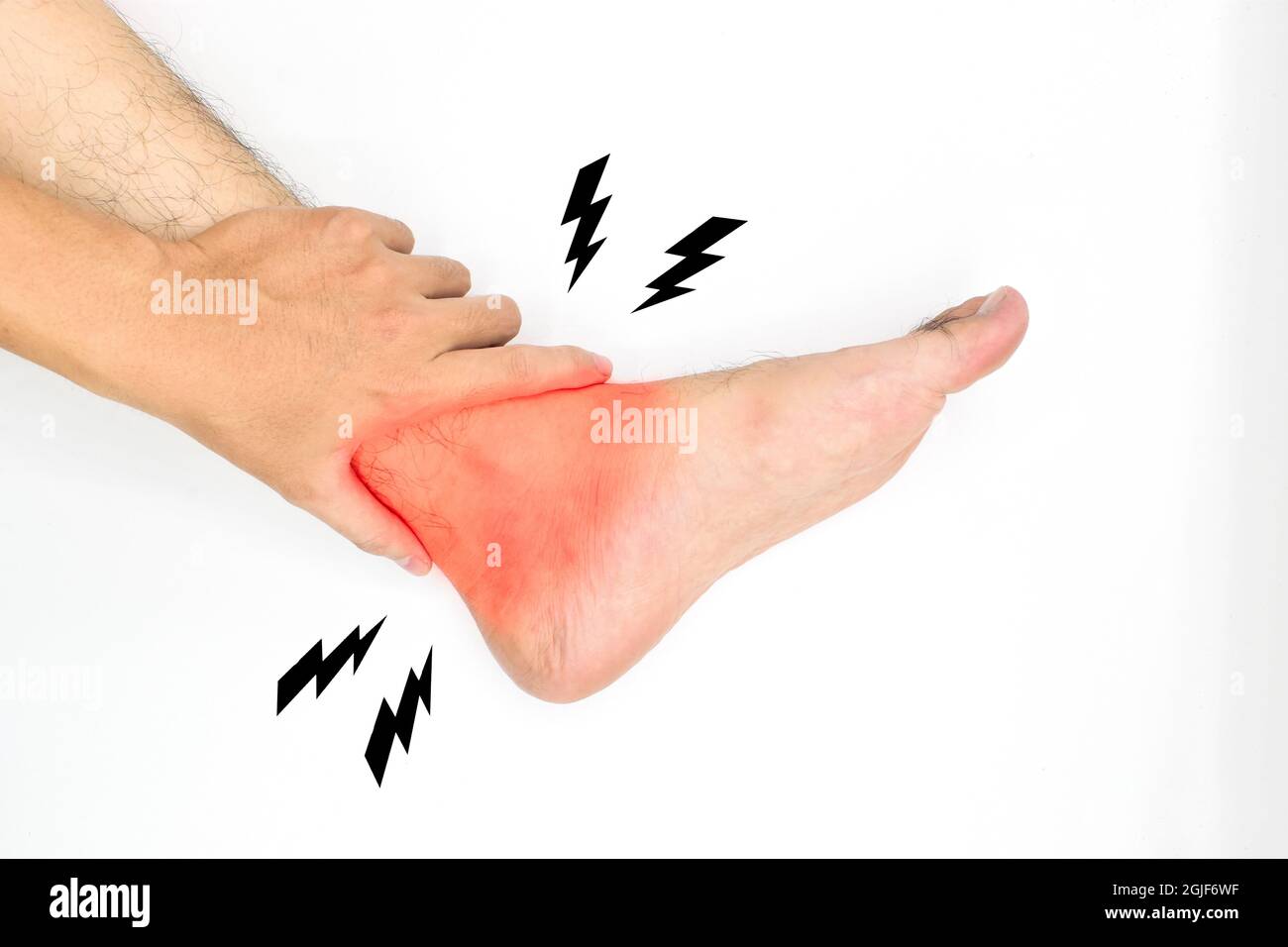 Inflammation of Asian young man’s ankle joint and foot. Concept of ...