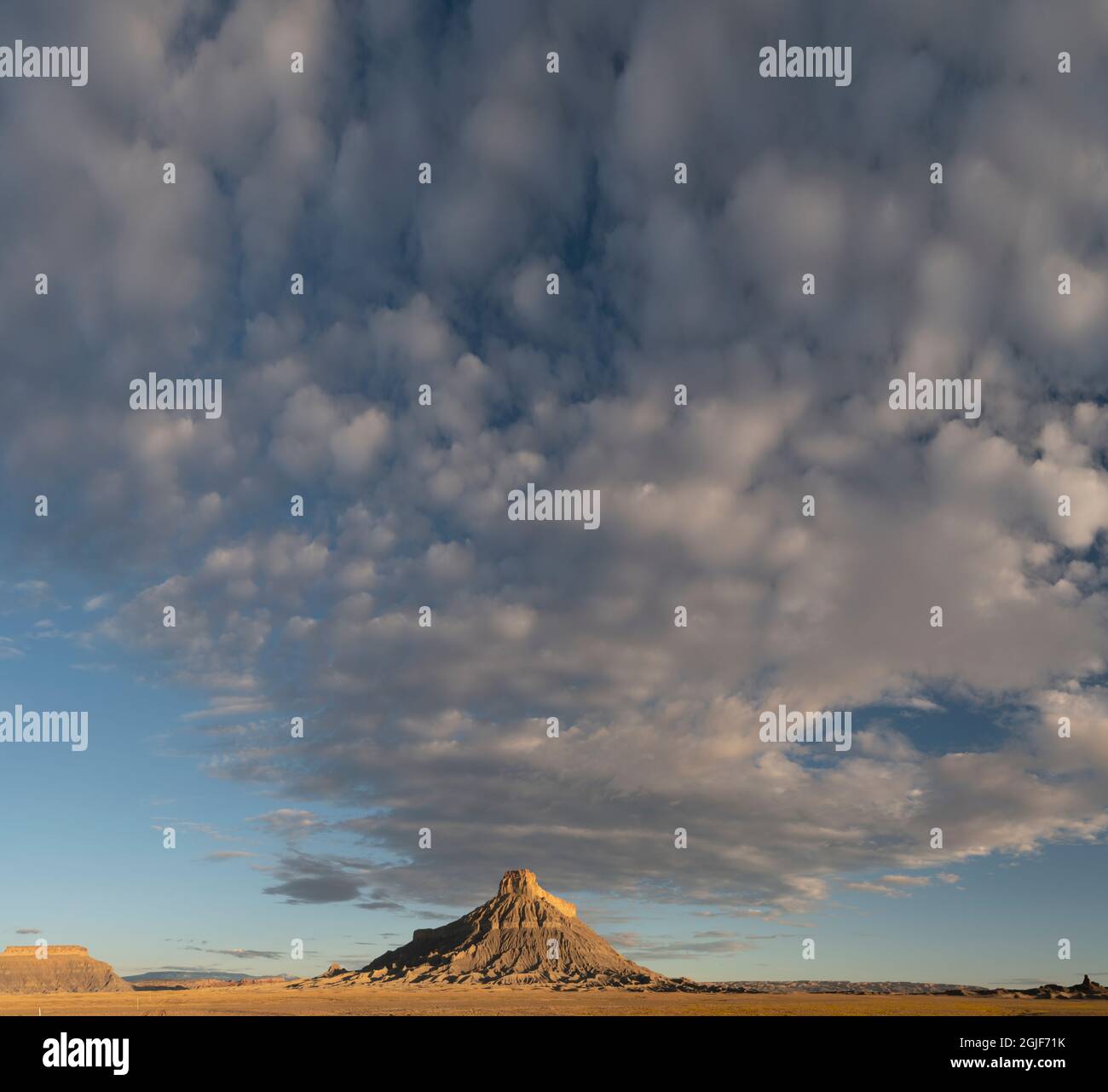 USA, Utah. Early morning clouds at Factory Butte, Upper Blue Hills ...