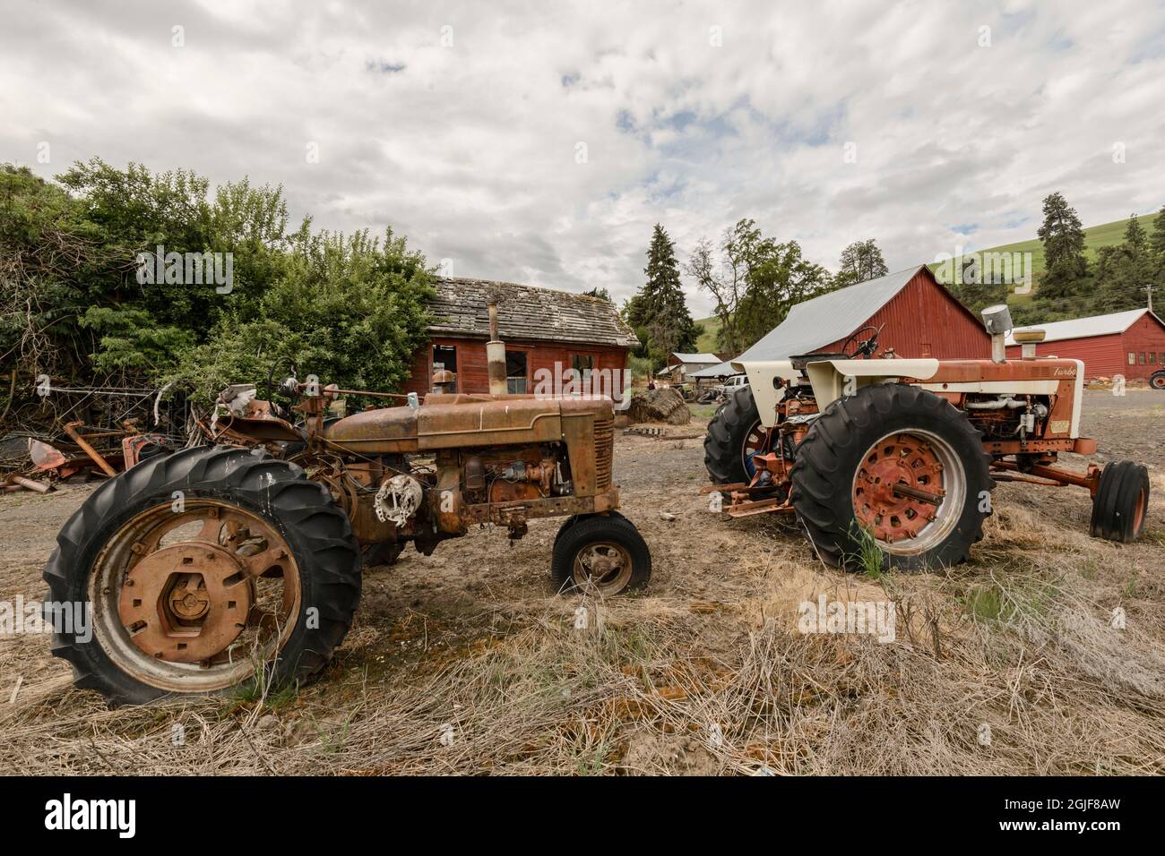 Old antique tractors lined up and red barns, Palouse agricultural ...