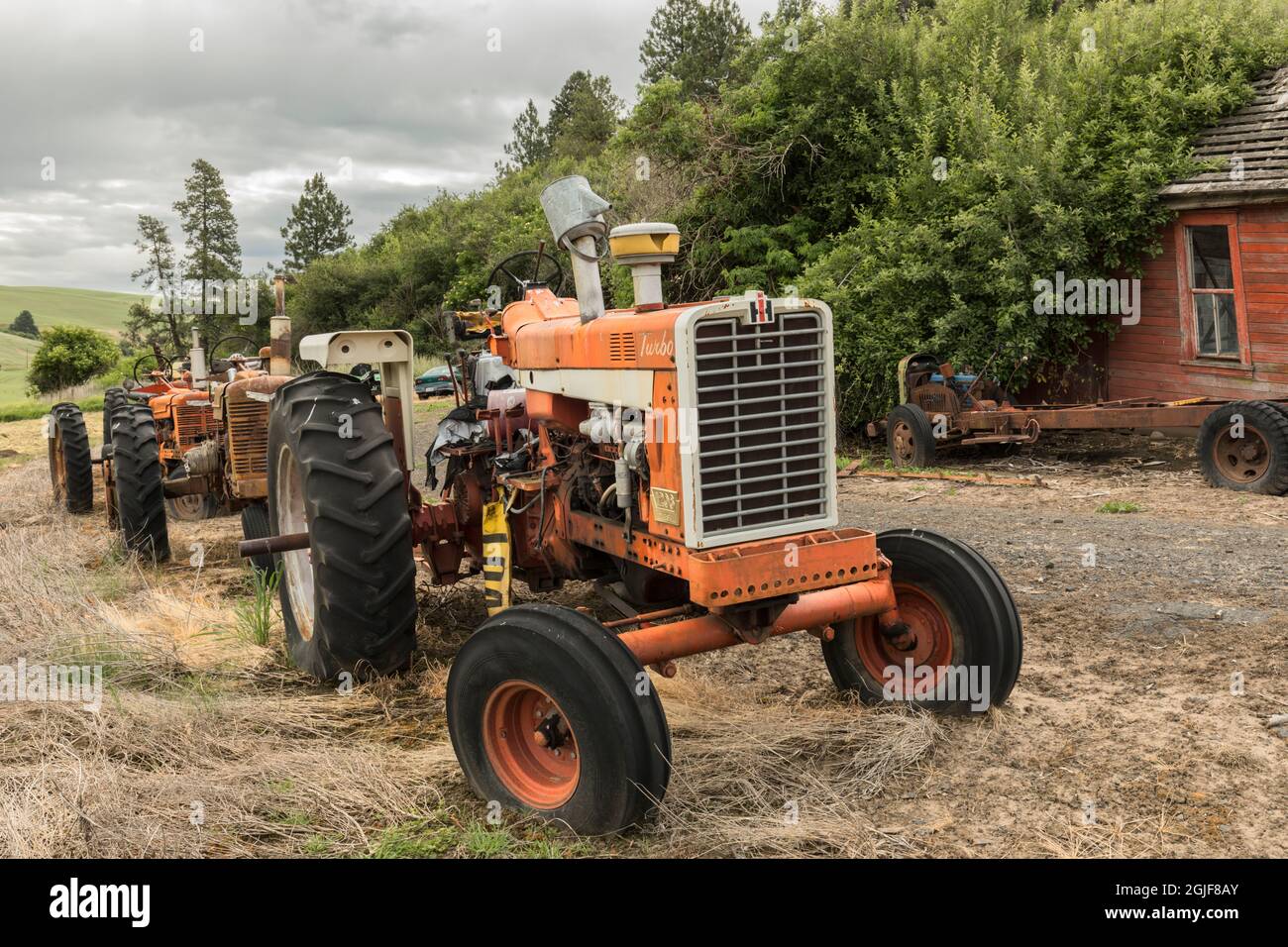 Old antique tractors lined up and red barns, Palouse agricultural ...