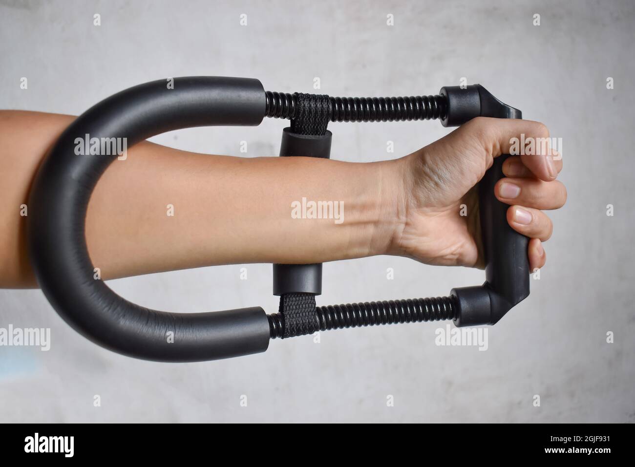 Wrist and forearm strengthener tool. Home light workout by man ...