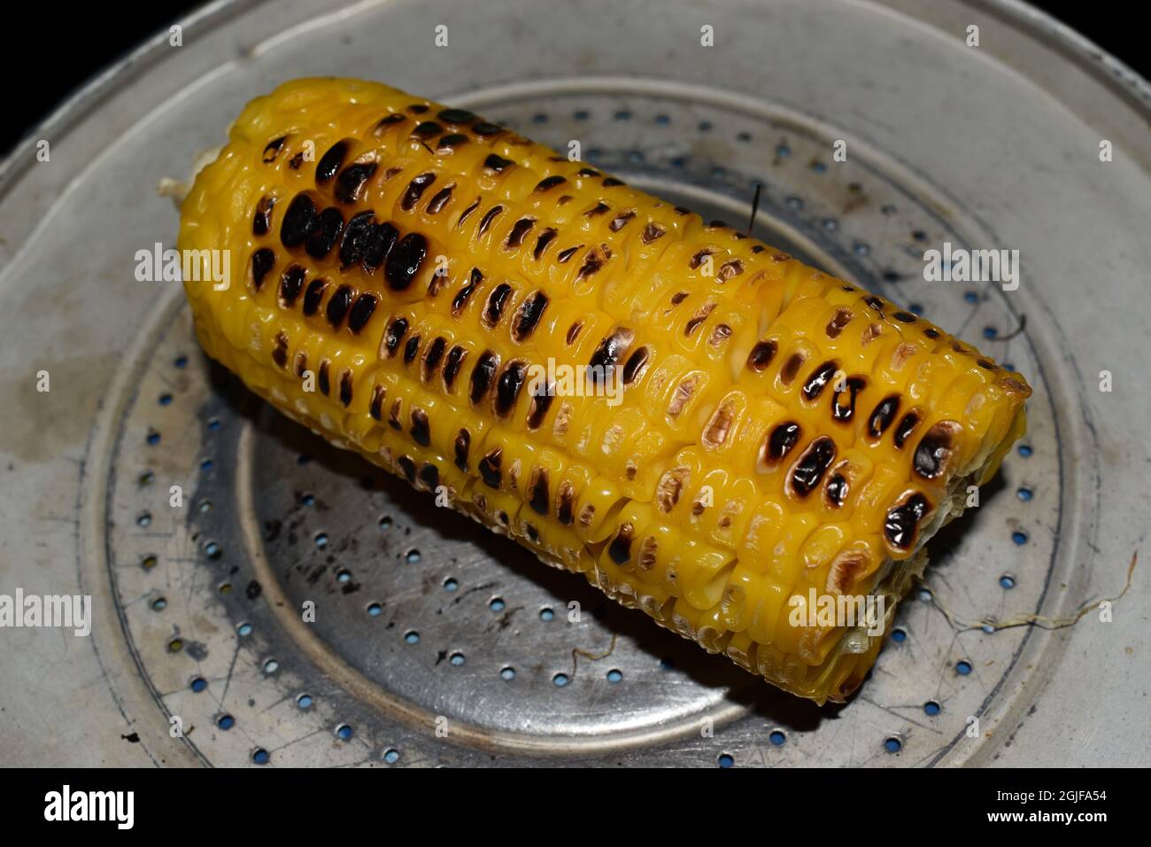 Myanmar or Burmese traditional street food, roasted corn. In medical ...