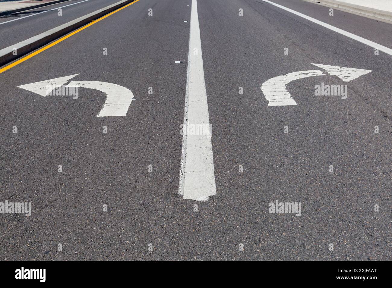 Directional arrows pointing left and right painted on a highway Stock ...