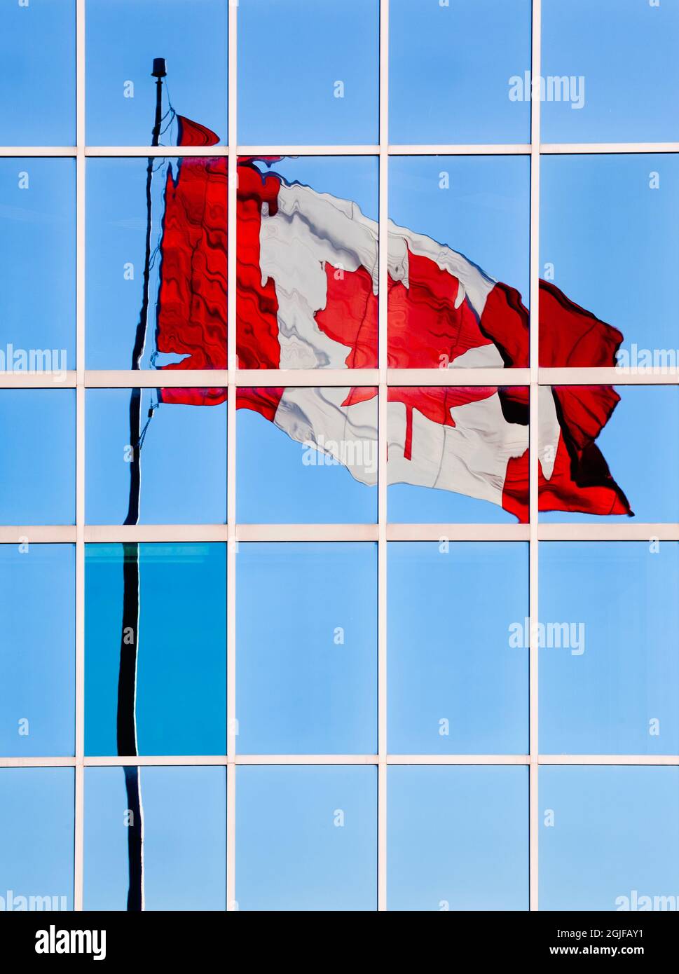 Canadian flag reflection on office building windows Stock Photo - Alamy