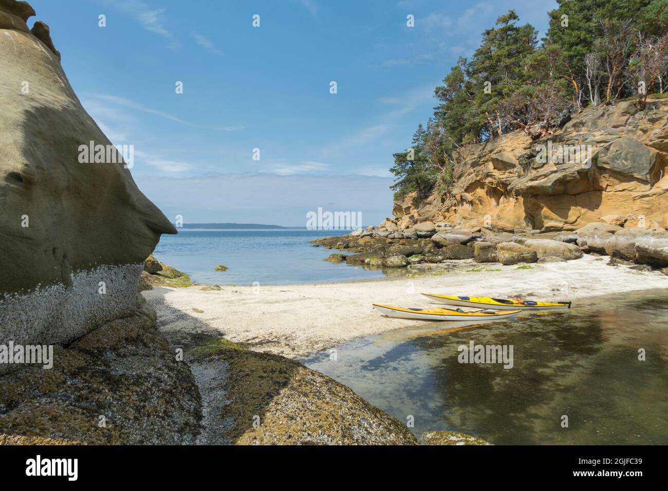USA, Washington State. Kayaks on tombolo (spit) at Chuckanut Island ...