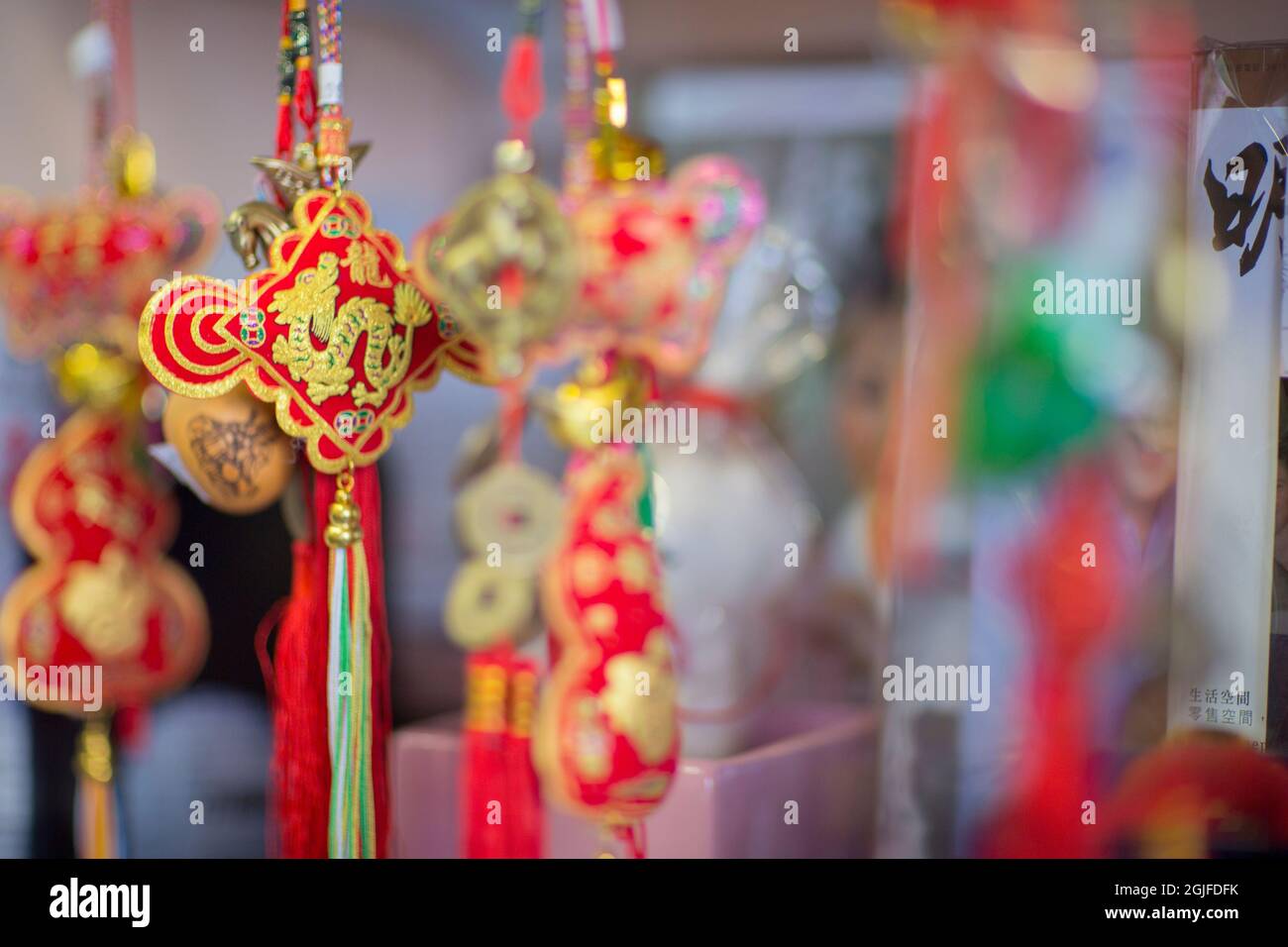 Usa, Washington State, Seattle, Silk dragon ornaments hanging in shop ...