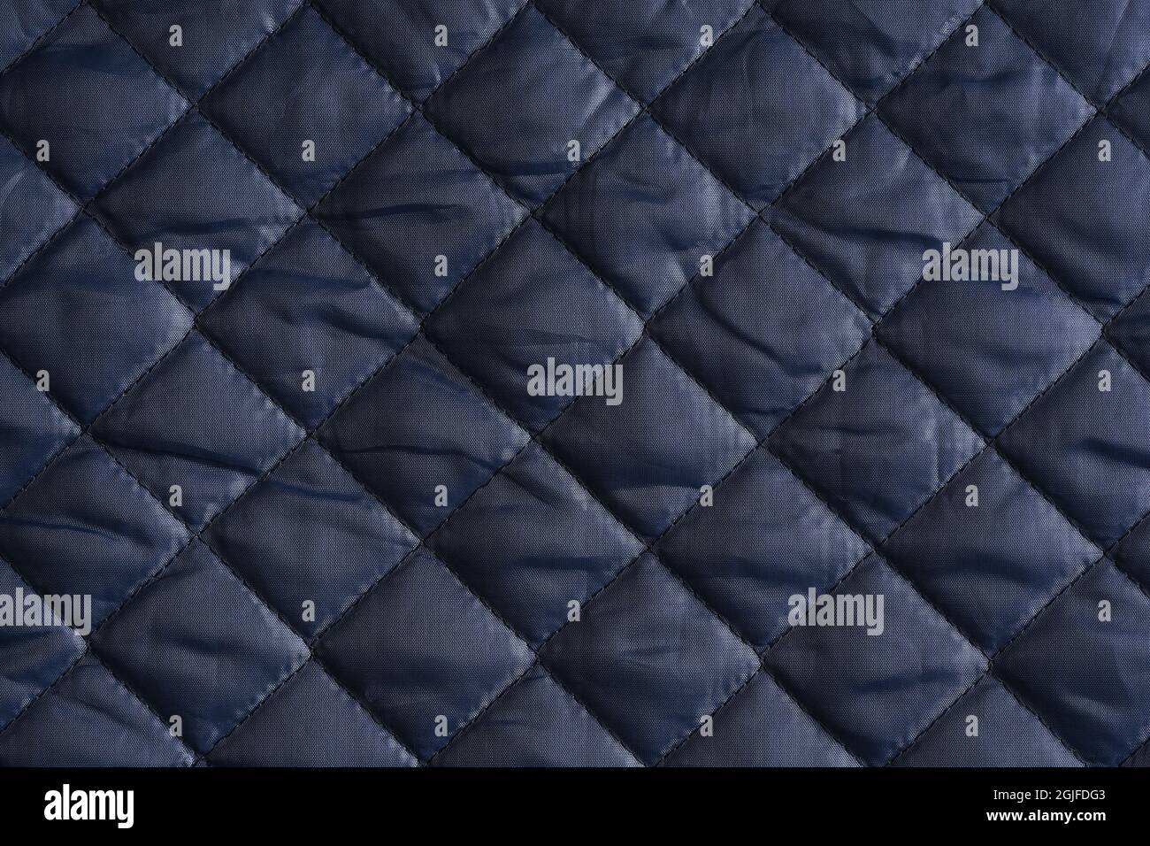 Closeup of blue rhombus diamond fabric texture for wallpaper background ...
