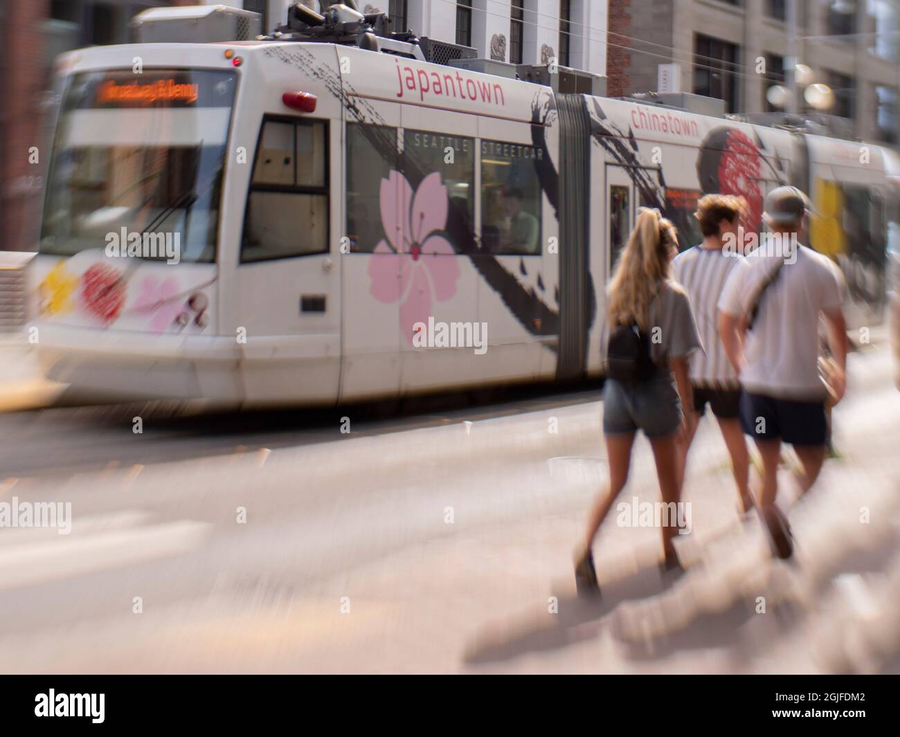 Usa, Washington State, Seattle, people and trolley in historic Pioneer ...