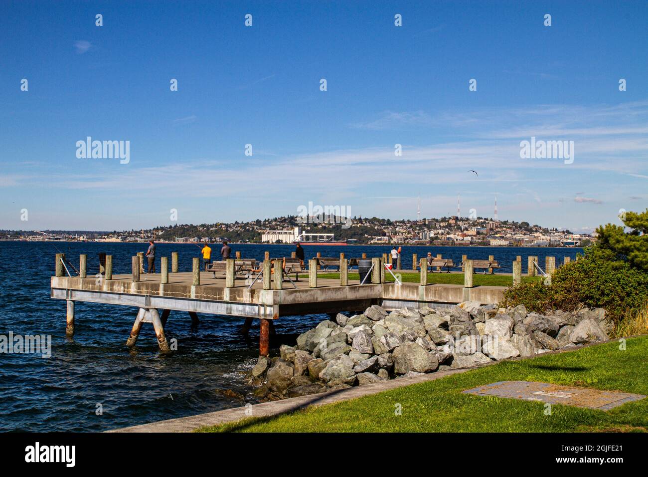 Alki Beach, West Seattle, Washington State. Fishing off of Alki Pier ...