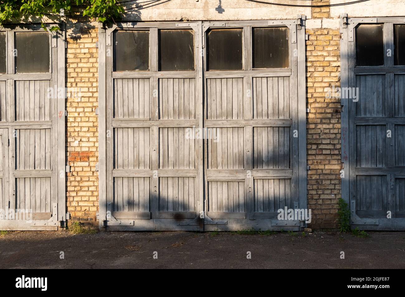 Large wooden gate to the building. Wooden gate to the garage. Gates for ...