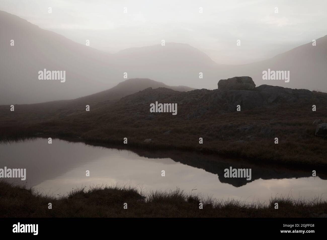 Esk Hause seen from a tarn on Tongue Head, in the English Lake District ...