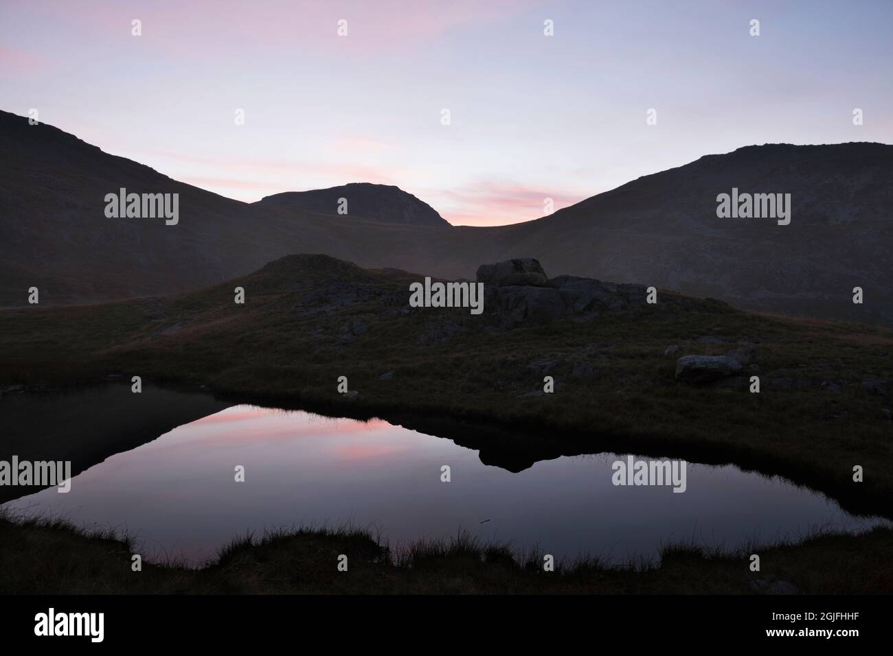 Esk Hause seen from a tarn on Tongue Head, in the English Lake District ...