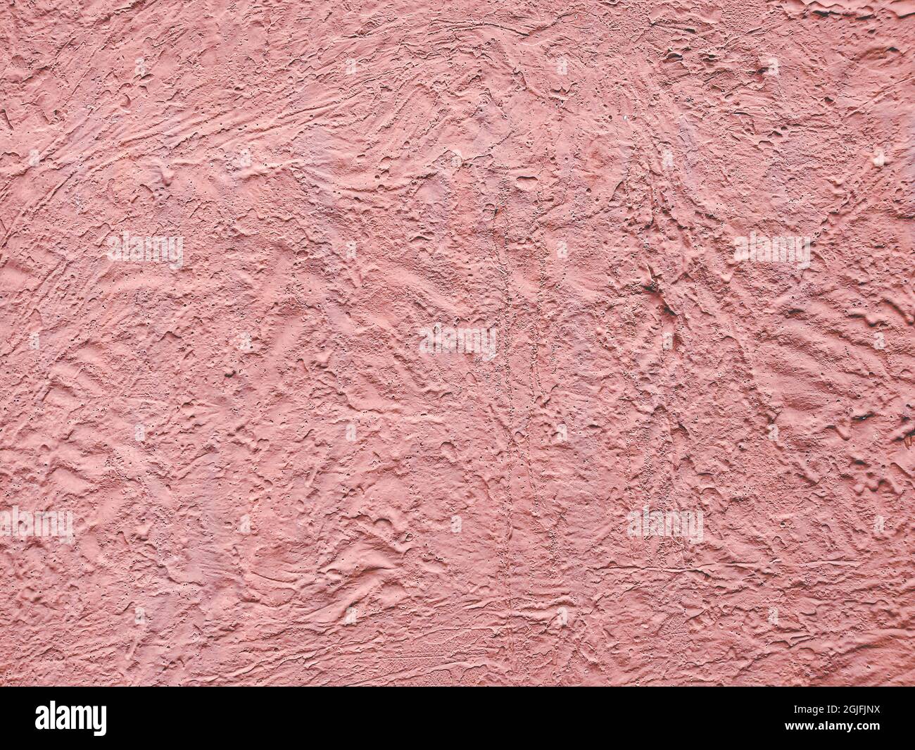 Pink textured stucco wall background Stock Photo - Alamy