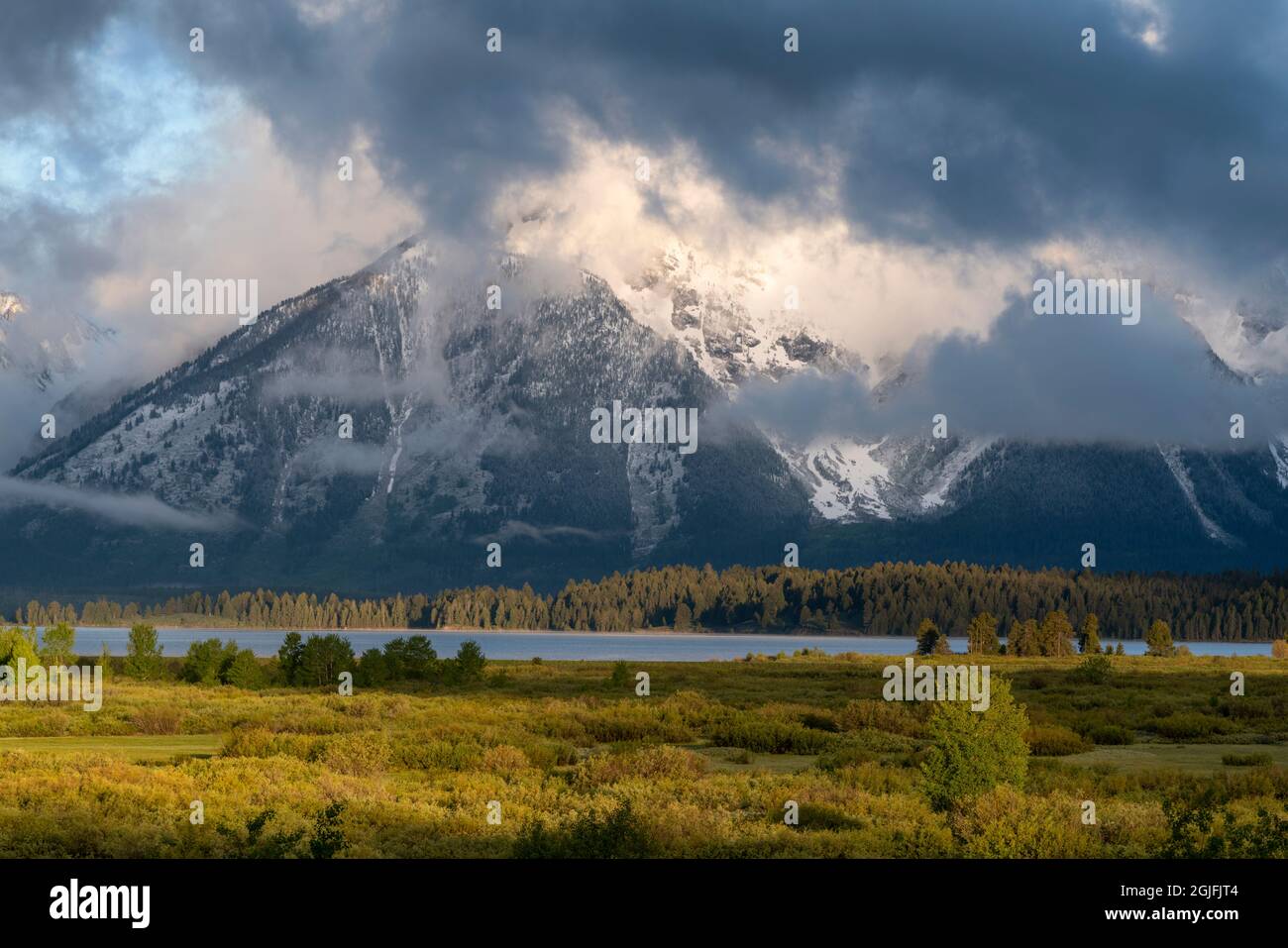 USA, Wyoming, Grand Teton National Park. A spring storm sends clouds ...