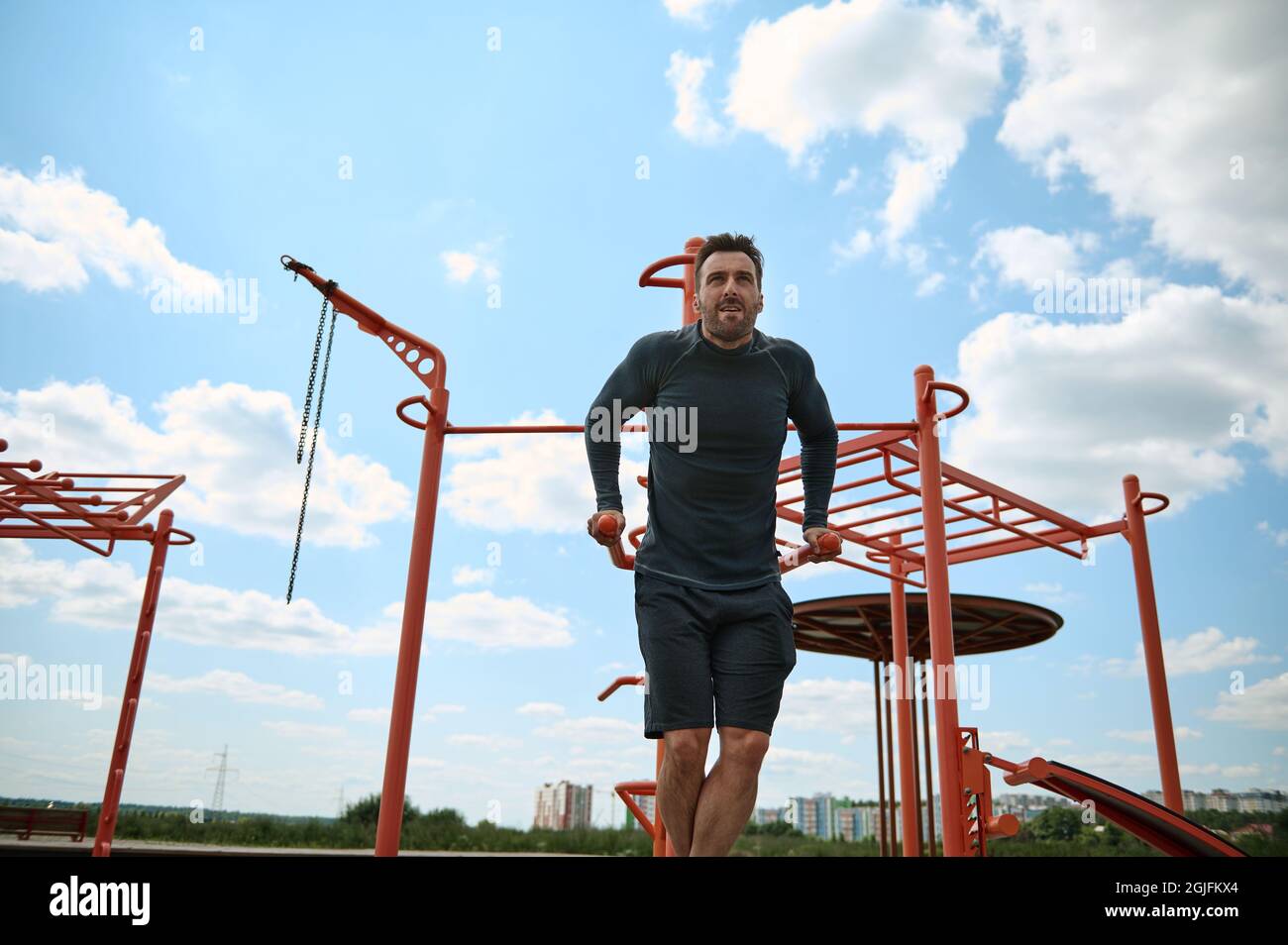 Handsome muscular built mature European Caucasian sportsman working out ...