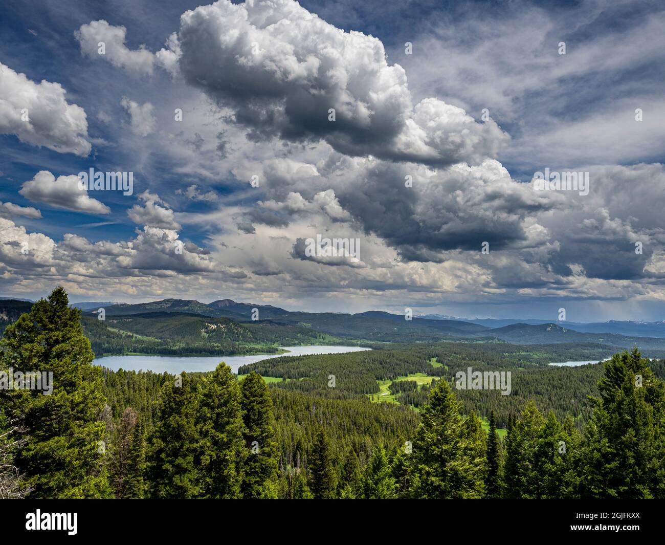 Evergreens, clouds and view of Emma Matilda Lake and Two Ocean Lake ...