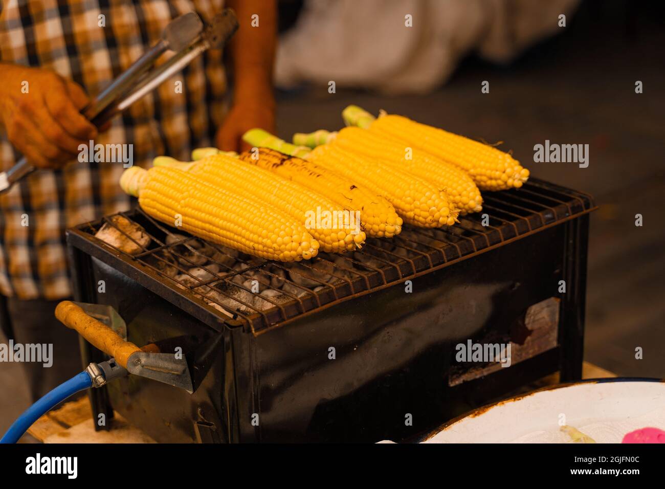 Fried corn on the grill on street. Healthy street food in Turkish ...