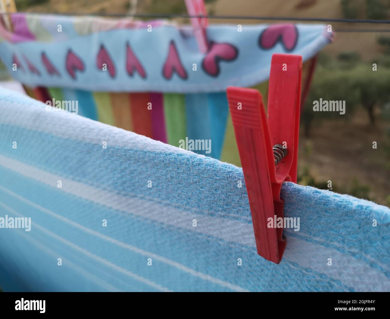 Closeup shot of laundry hanging from a clothespin Stock Photo - Alamy