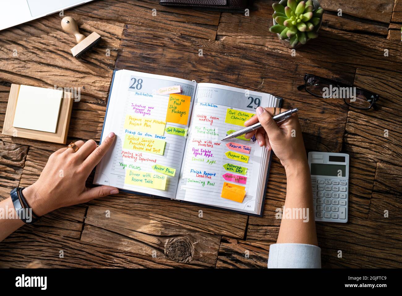 Calendar Schedule Agenda Or Organizer At Desk Stock Photo - Alamy