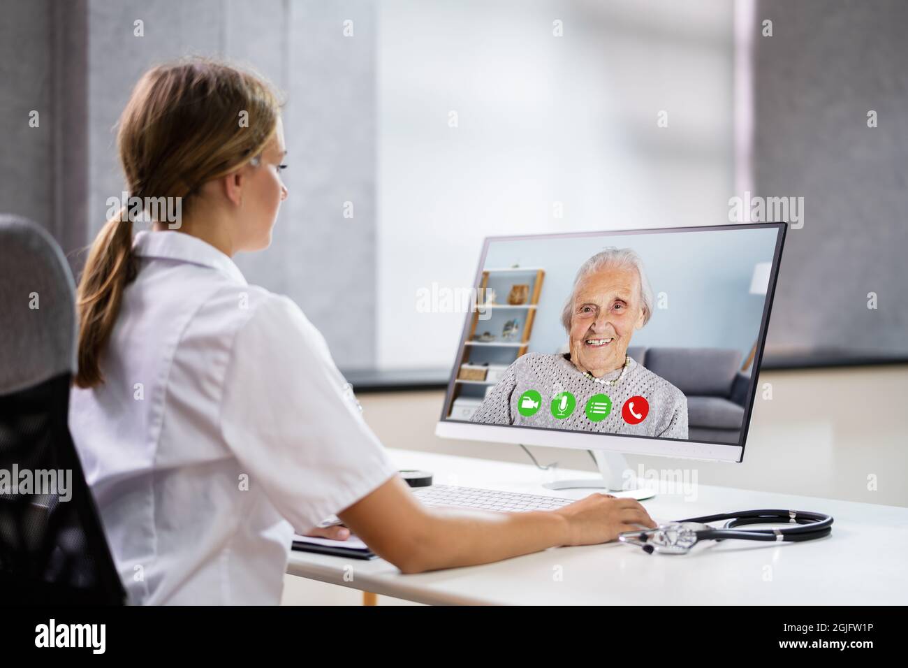 Doctor talking patient using virtual hi-res stock photography and ...
