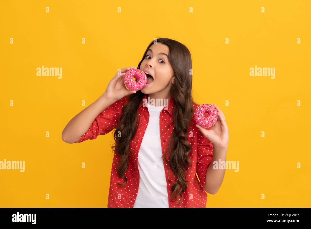 happy child eating sweet glazed donut, yummy Stock Photo - Alamy