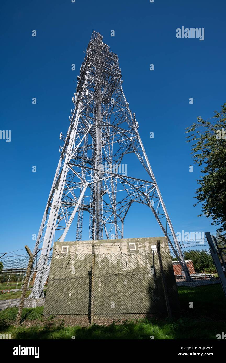 A view of a metal power tower with satelite dishes mounted in Norfolk ...