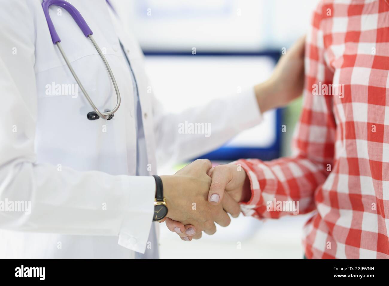 Closeup doctor patient shaking hands hi-res stock photography and ...