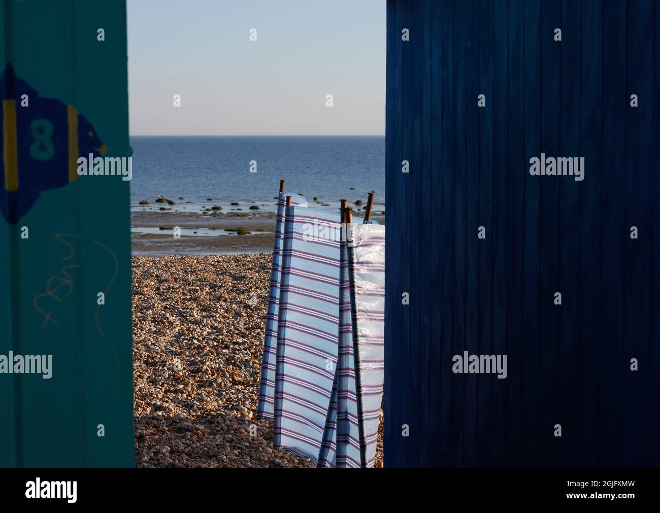 Blue coloured windscreen seen on the beach in the UK Stock Photo - Alamy