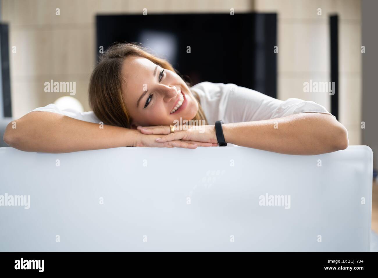 Happy Warm Woman Indoors Near Radiator Heater Stock Photo - Alamy