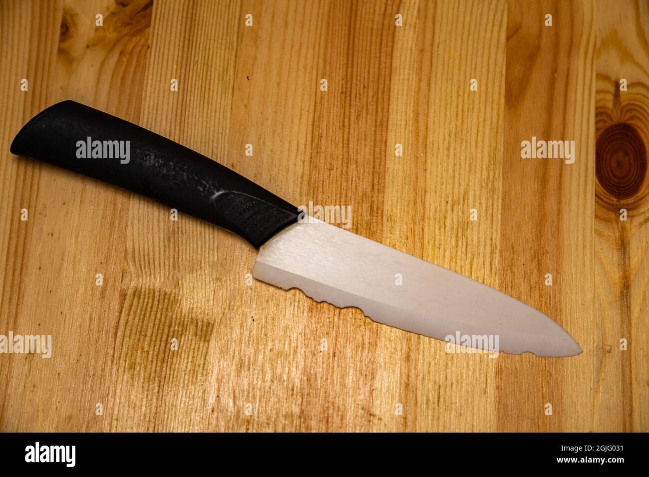 close up old white ceramic knife with a chipped blade. broken ...