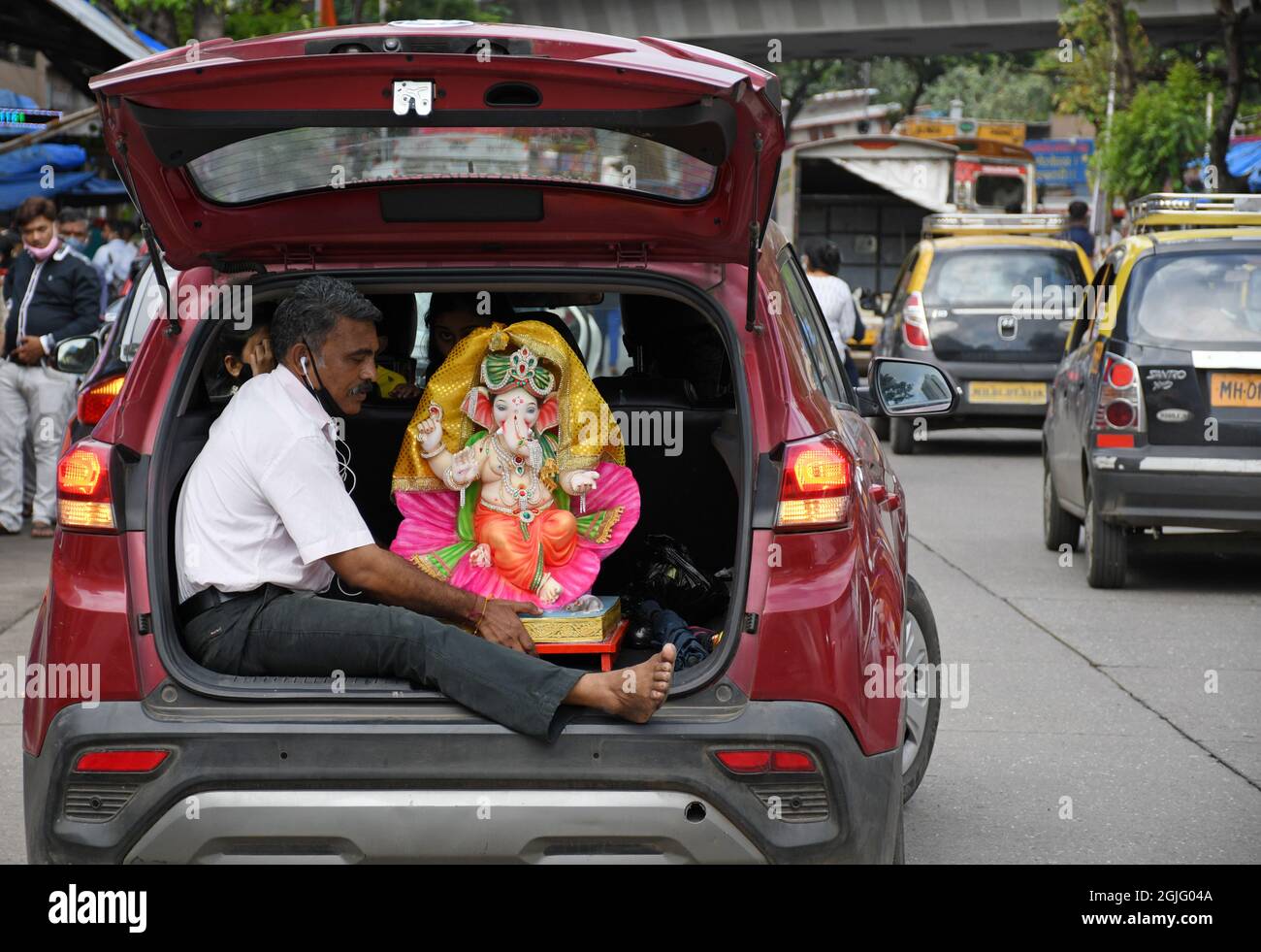 Mumbai, India. 09th Sep, 2021. A man takes an idol of Hindu god Ganesh ...