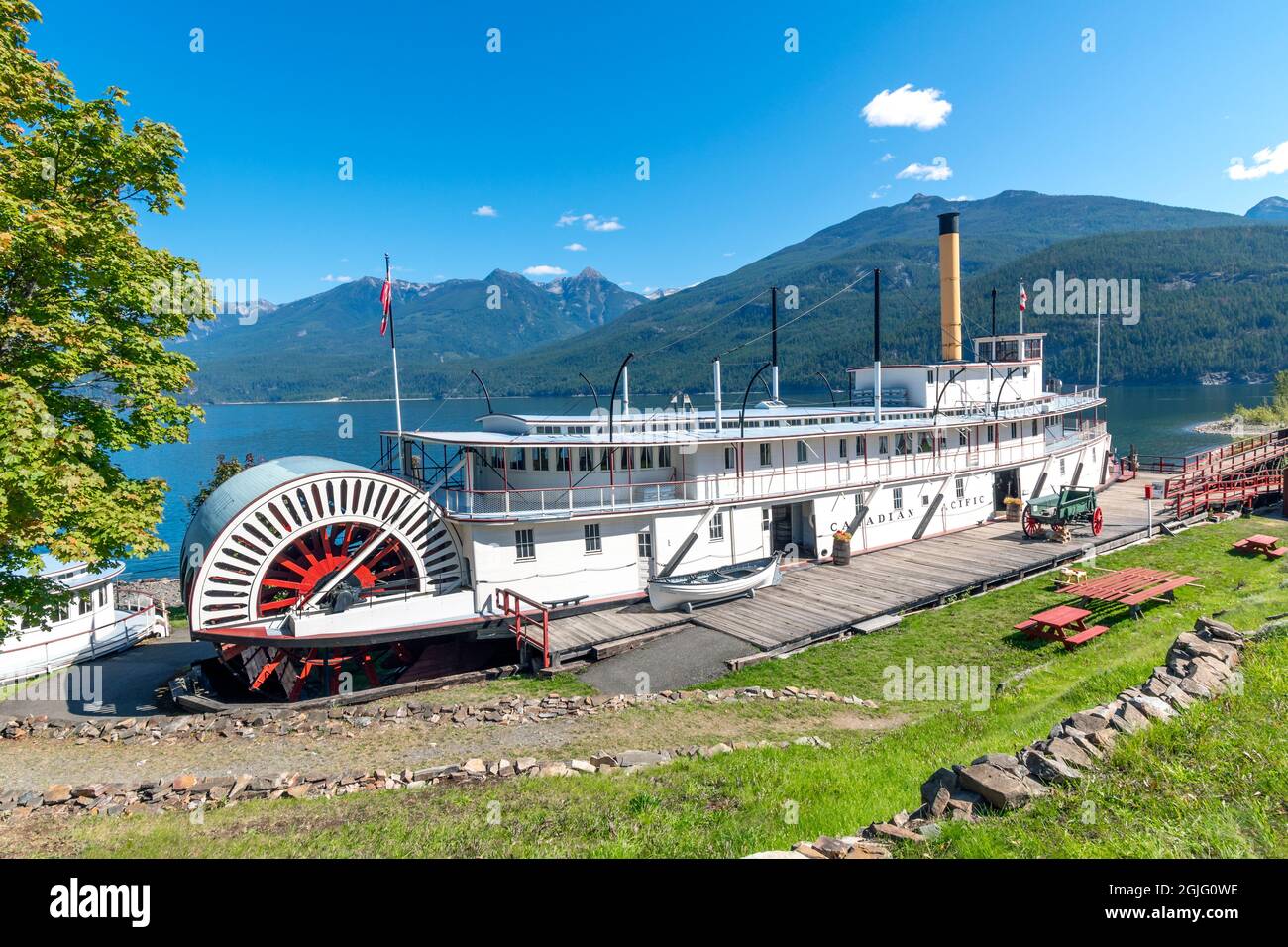 A vintage paddle steamer sternwheeler sits in the bay at Kootenay Lake ...