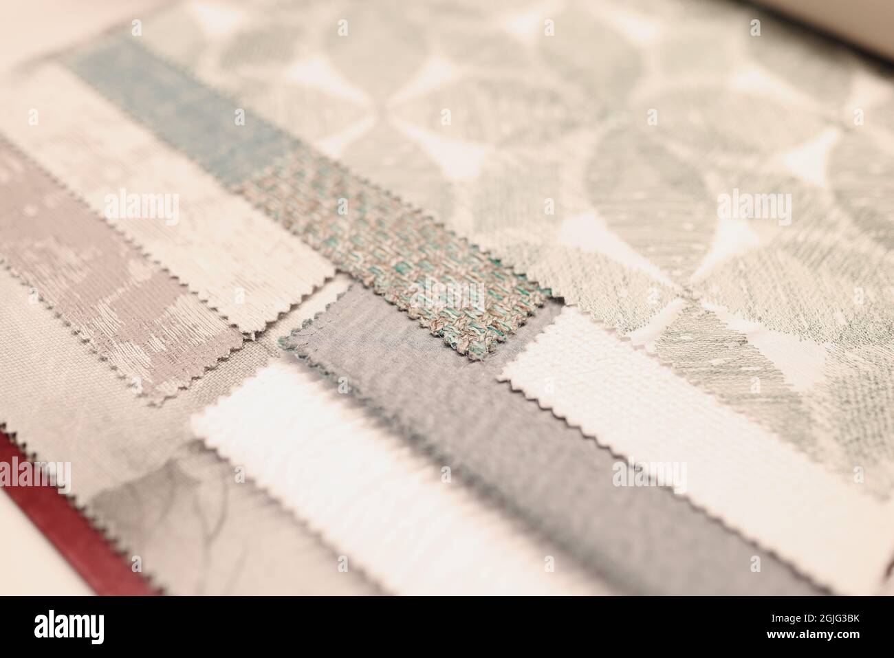 Closeup of samples of upholstery fabrics in store Stock Photo - Alamy