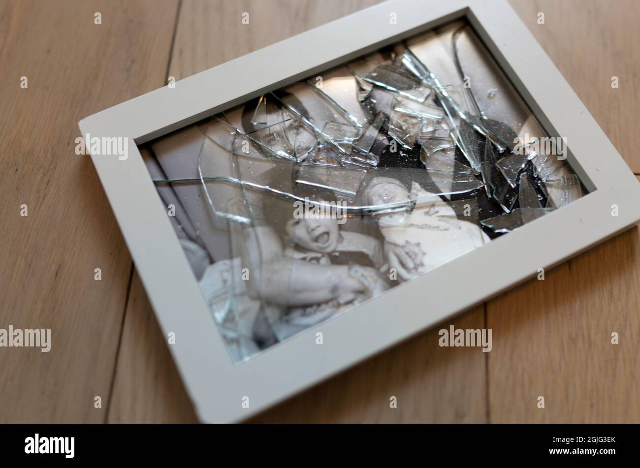 family of four in broken frame Stock Photo - Alamy