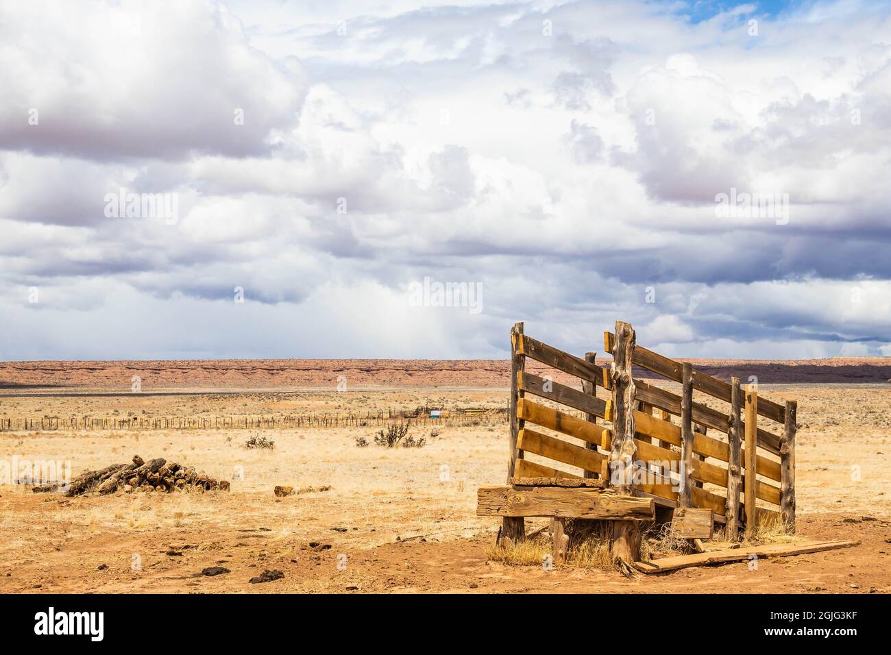 An old corral, abandoned in the desert of Arizona under a blue sky with ...