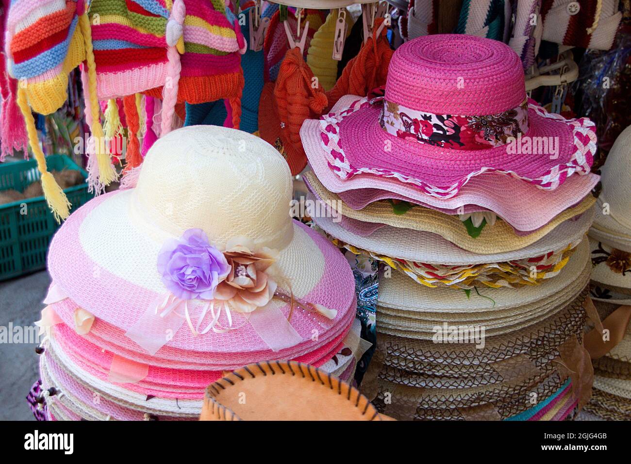 Array of pink and white hats on display at a roadside store Stock Photo ...