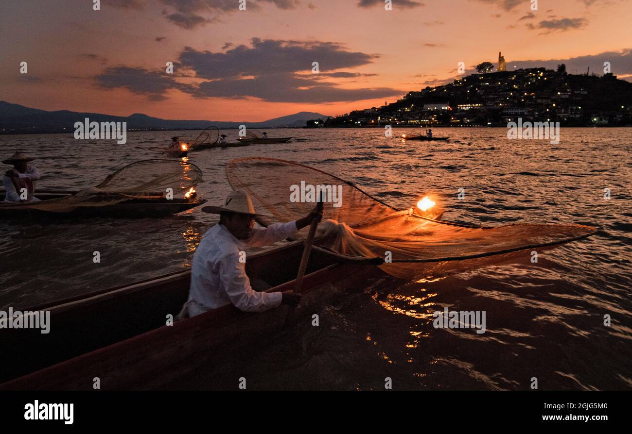 Indigenous Mexican Purepecha fisherman using traditional butterfly nets ...