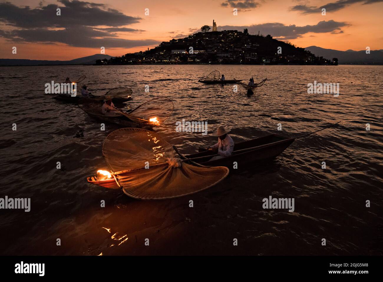 Indigenous Mexican Purepecha fisherman using traditional butterfly nets ...