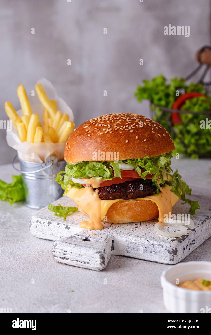 Cheeseburger with beef cutlet and vegetables Stock Photo - Alamy
